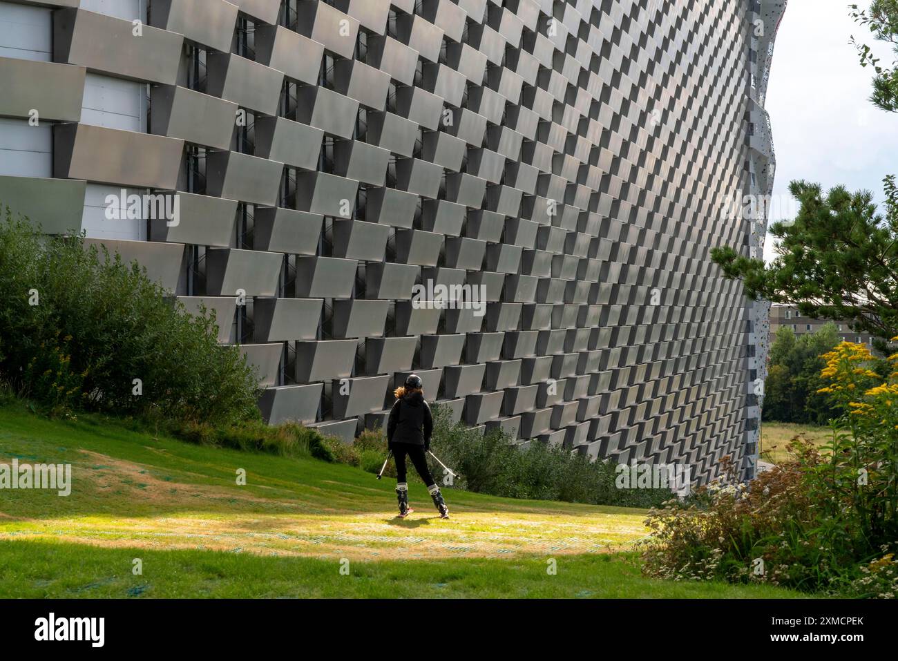 CopenHill, waste incineration plant and artificial ski slope, skiing with a view of the ski lift ...