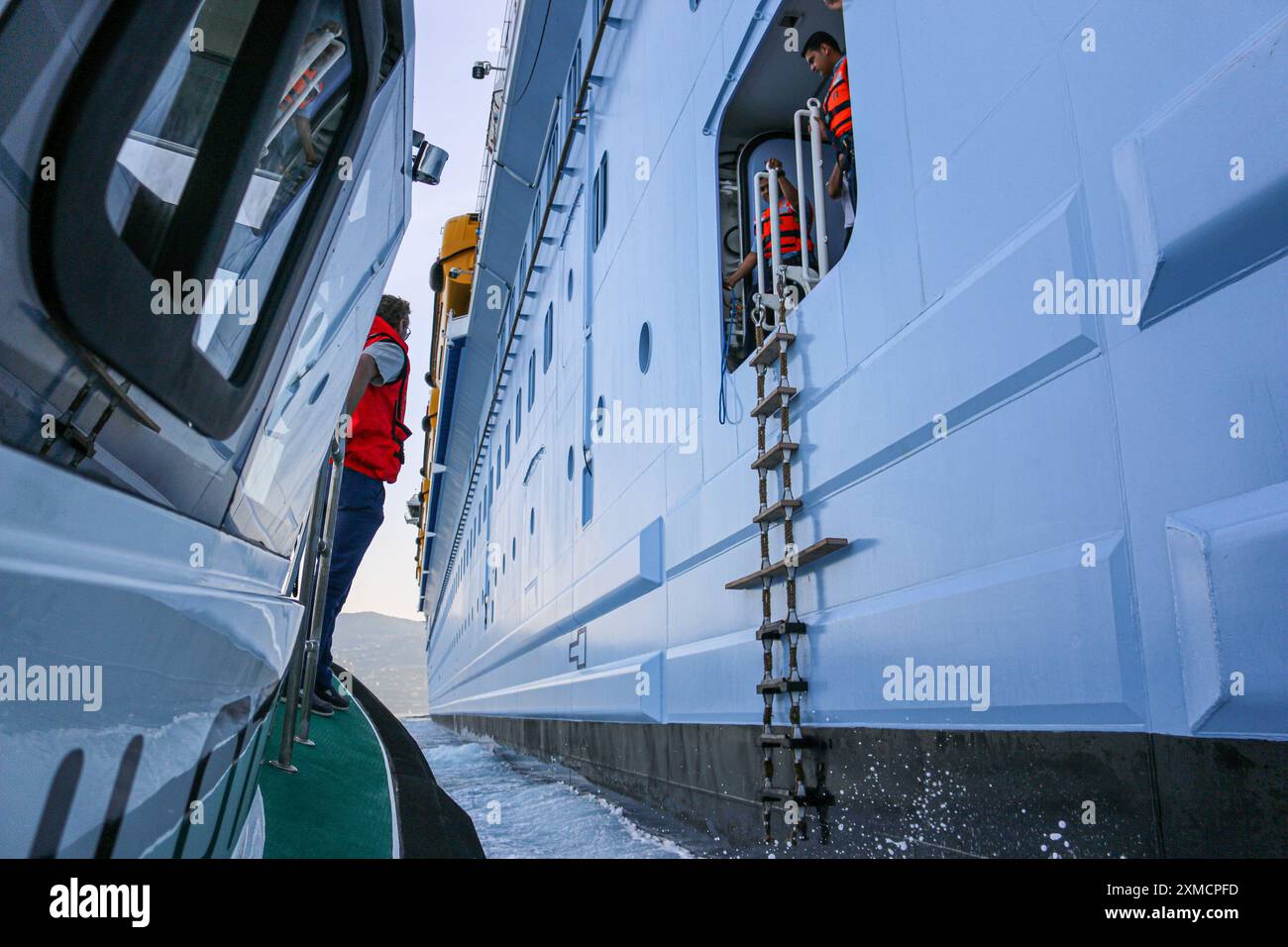 Nice, France : Harbor pilot boat approaching the giant Royal Caribbean ...