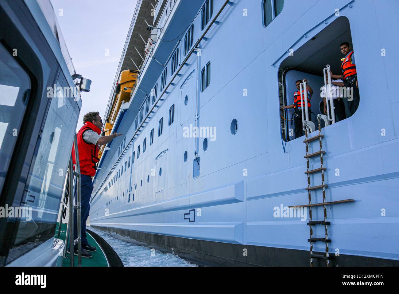 Nice, France : Harbor pilot boat approaching the giant Royal Caribbean ...