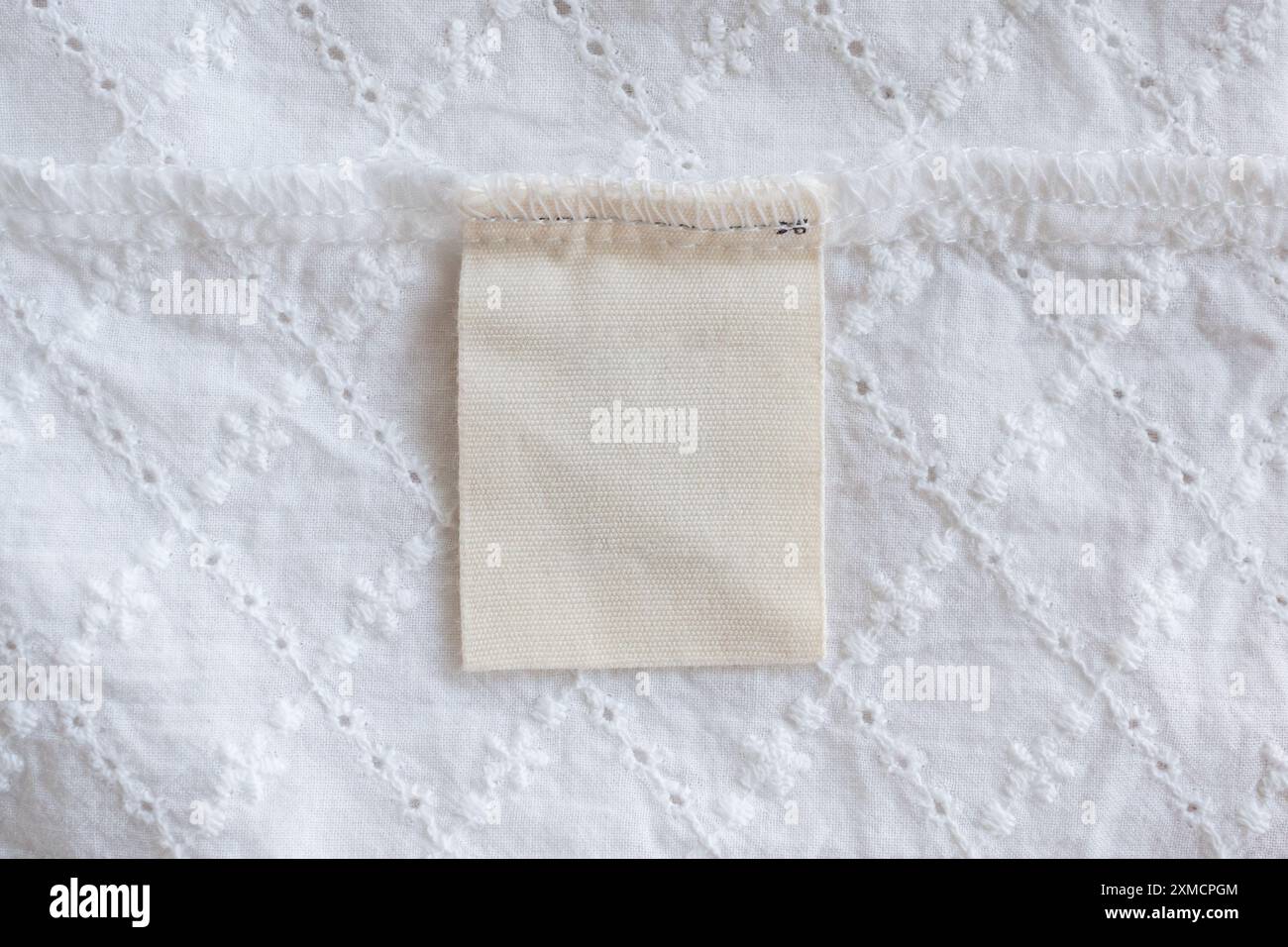blank laundry care clothes label on fabric texture background Stock ...