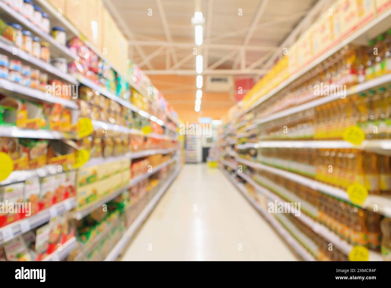 supermarket aisle with seasoning and cooking vegetable oil bottles ...