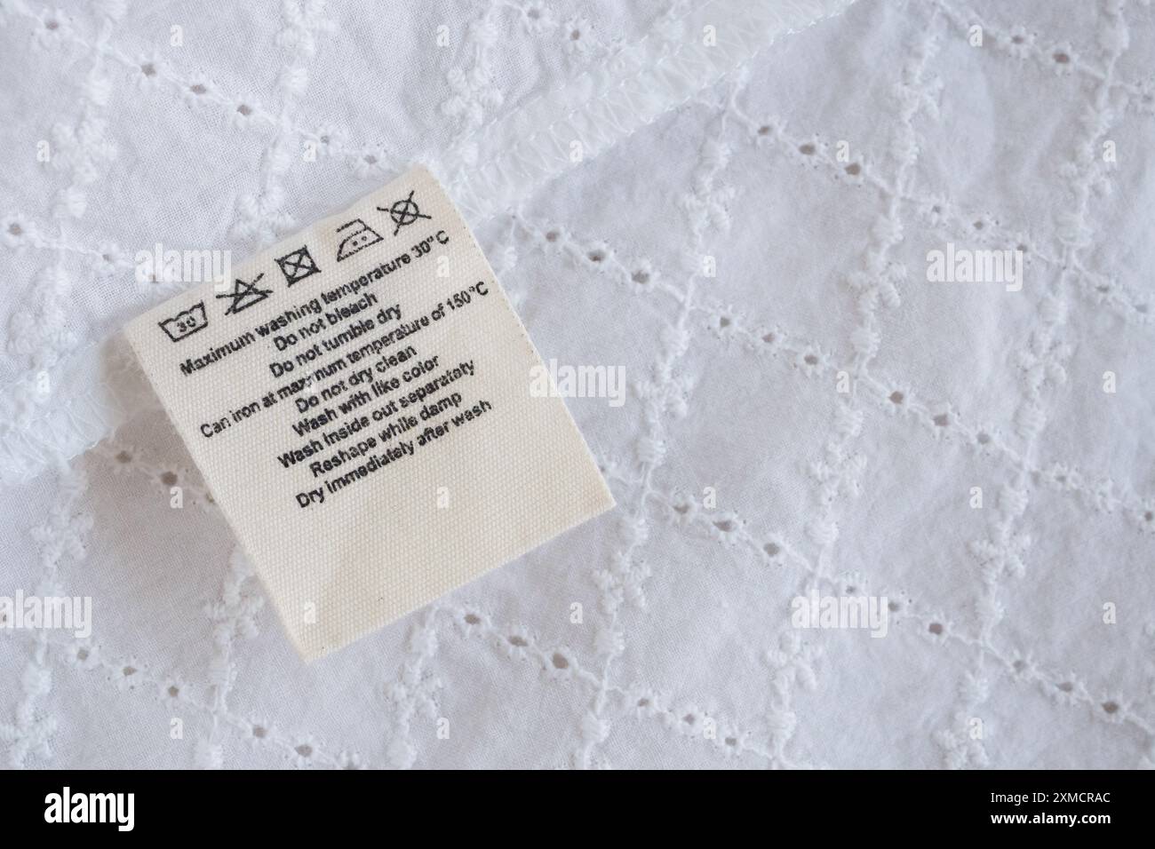 laundry care washing instructions clothes label on fabric texture ...