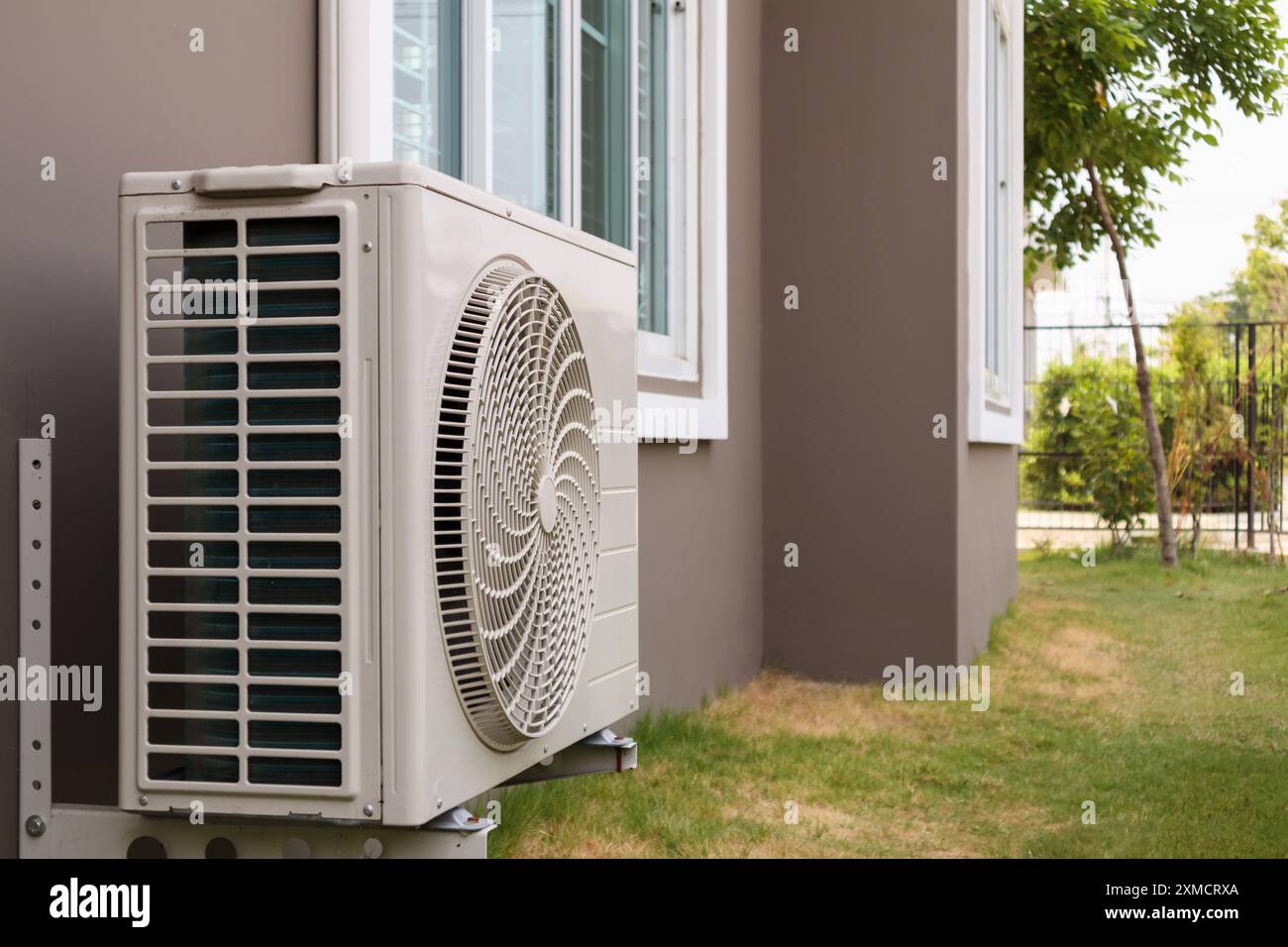 Air conditioner compressor outdoor unit installed outside the house ...