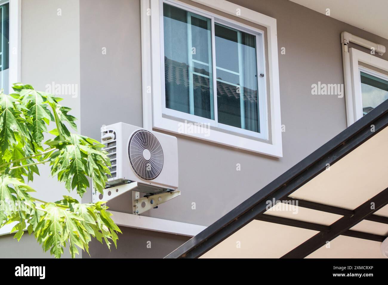 Air conditioner compressor outdoor unit installed outside the house ...