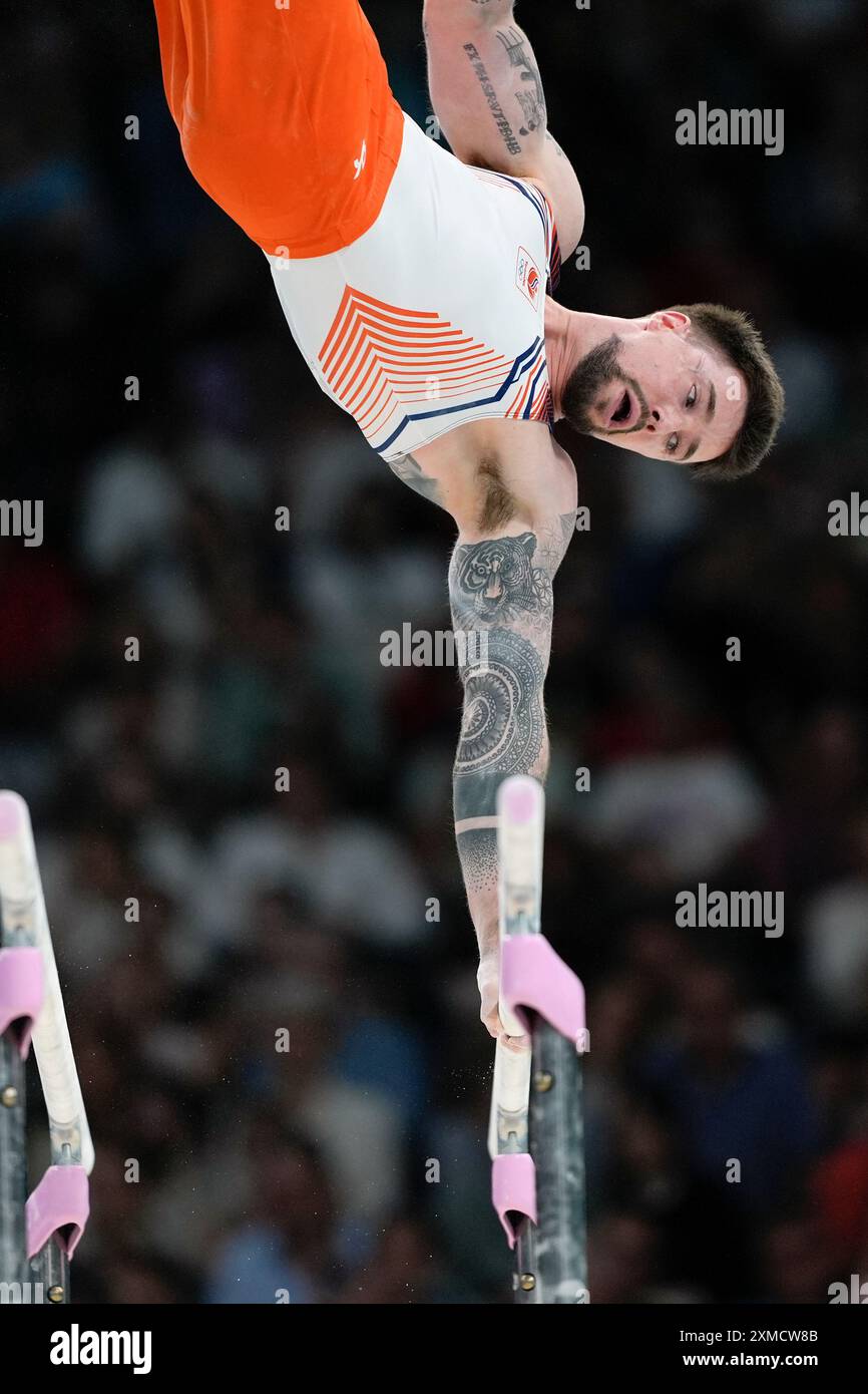 Casimir Schmidt, of Netherlands, competes on the parallel bars during a ...