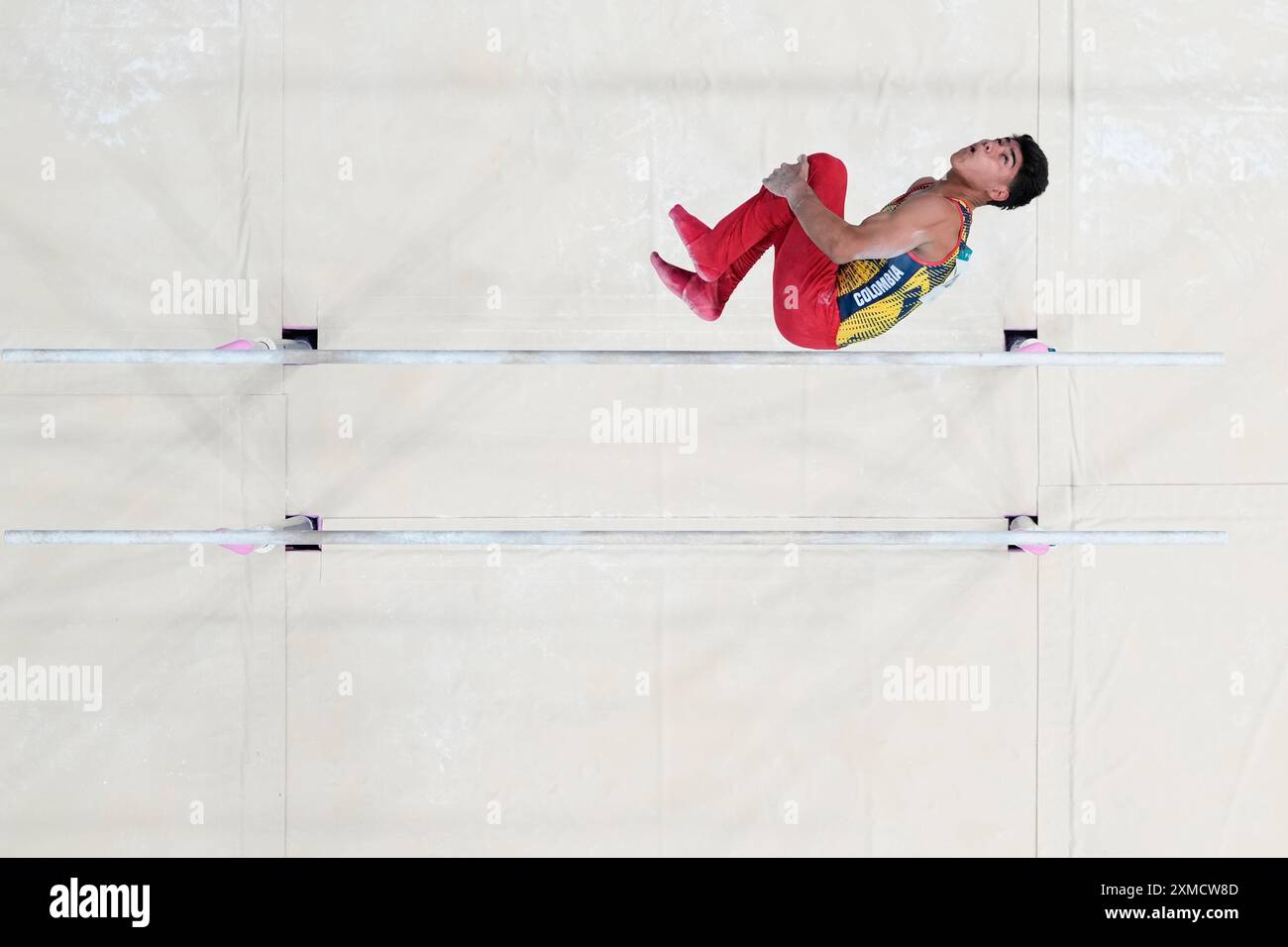 Angel Barajas, of Colombia, performs on the parallel bars during a men ...
