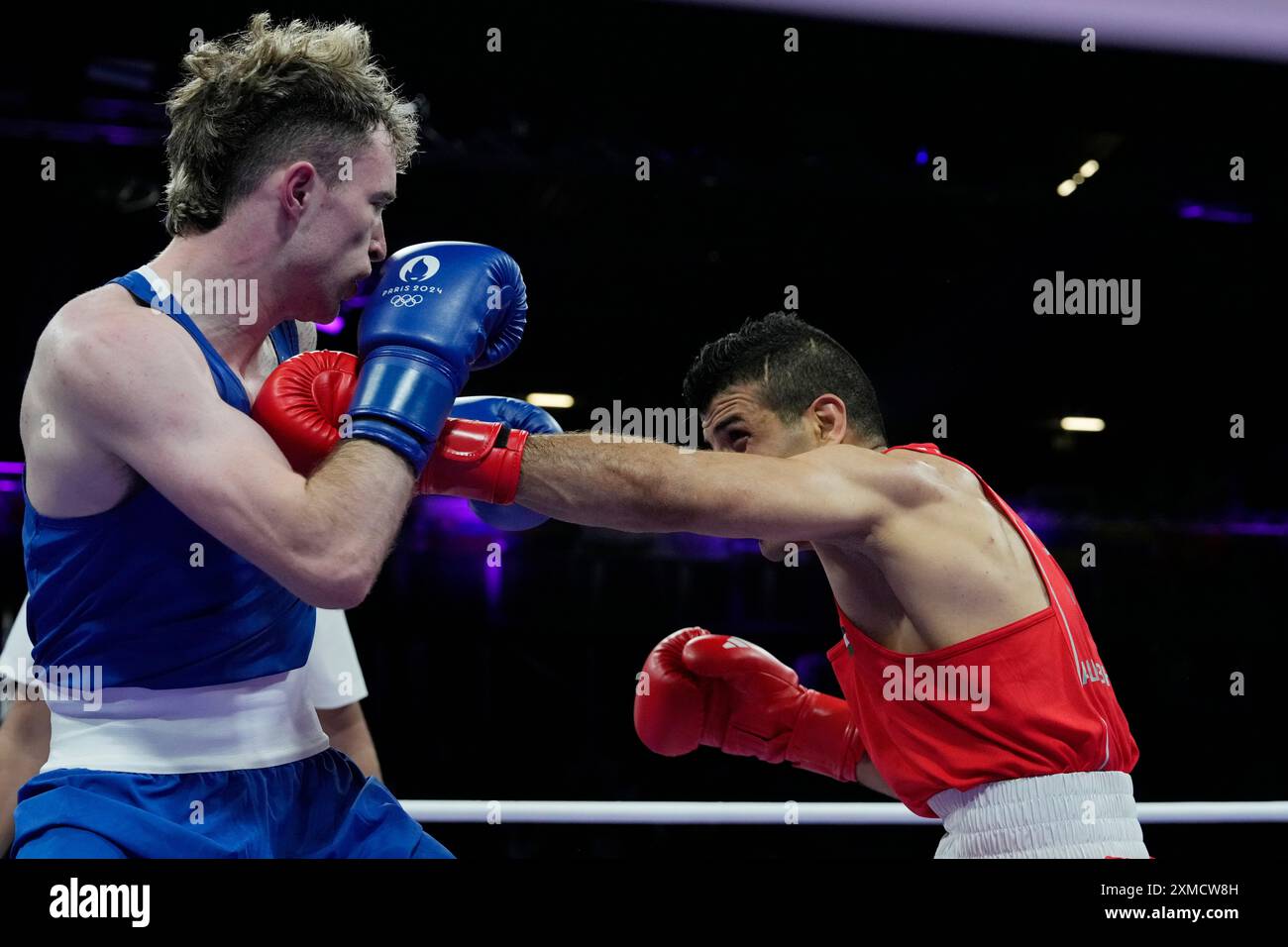 Jordan's Obada Alkasbeh hits Ireland's Dean Clancy in their men's 63.5 ...