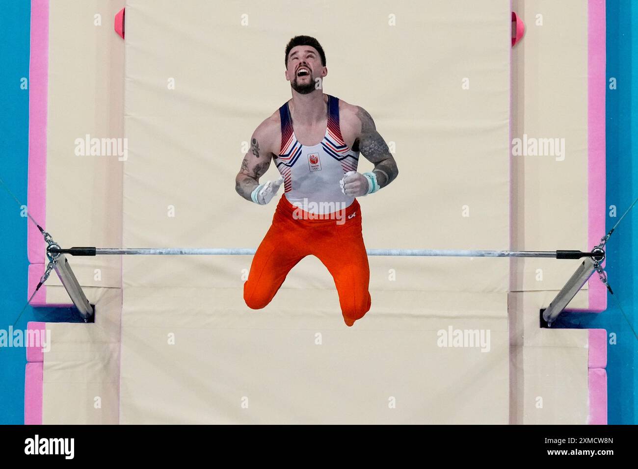 Casimir Schmidt of the Netherlands performs on the horizontal bar ...