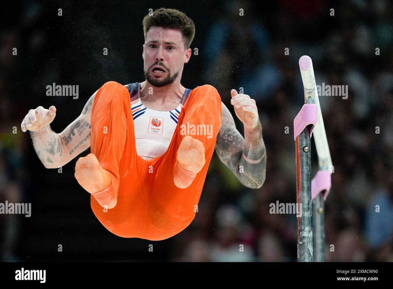Casimir Schmidt, of Netherlands, competes on the parallel bars during a ...