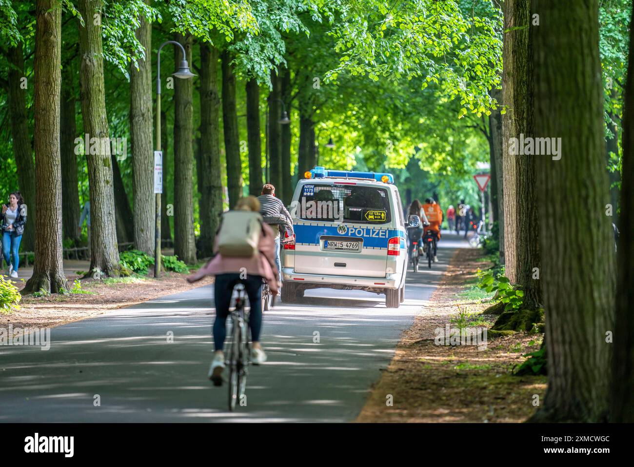 Police patrol on the Promenade cycle path, a tree-lined, car-free ...