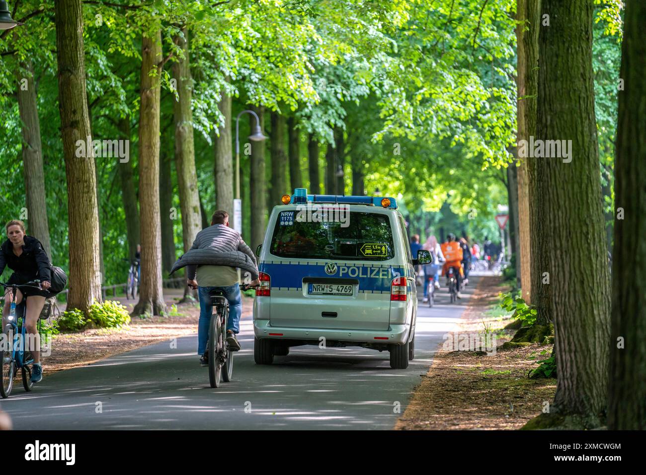 Police patrol on the Promenade cycle path, a tree-lined, car-free ...