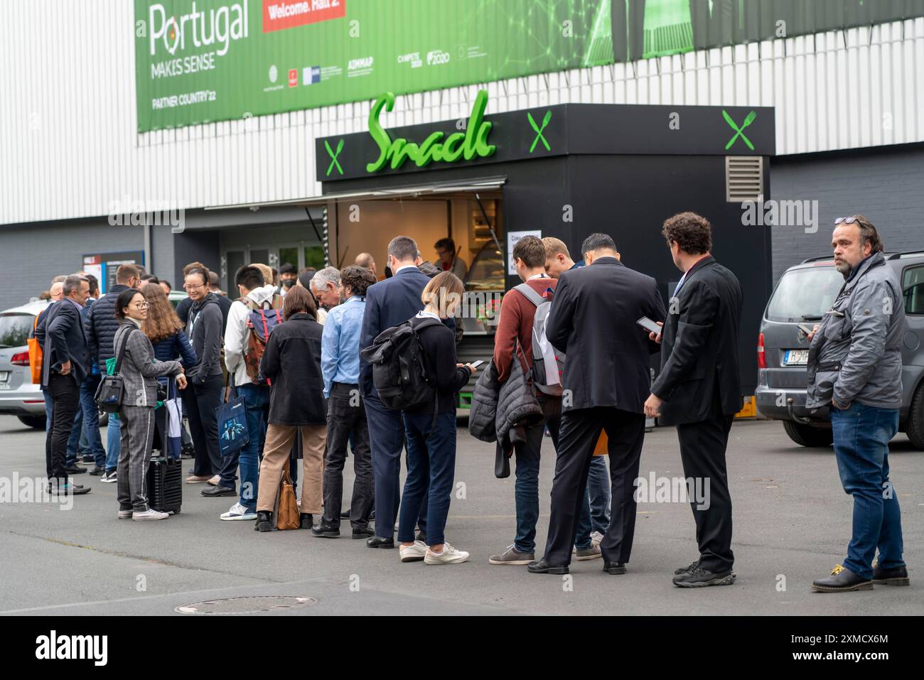 Long queues in front of a snack bar at Hannover Messe 2022, industrial ...