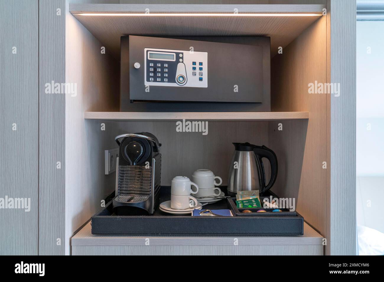 Hotel safe, in a hotel room, coffee machine, glasses, cups, as a ...