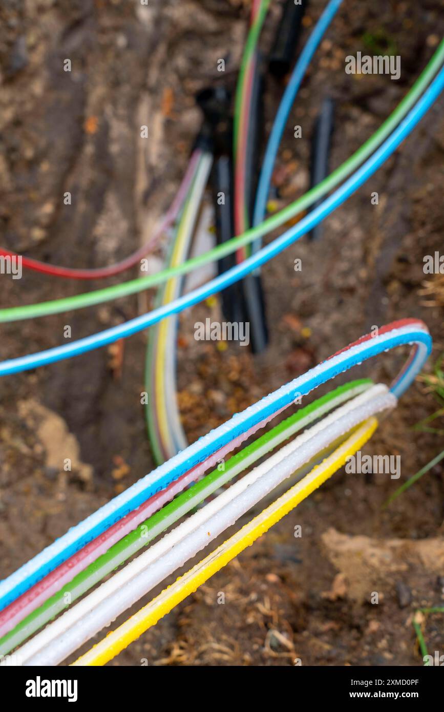Laying of fibre optic cables, construction site, excavation pit ...