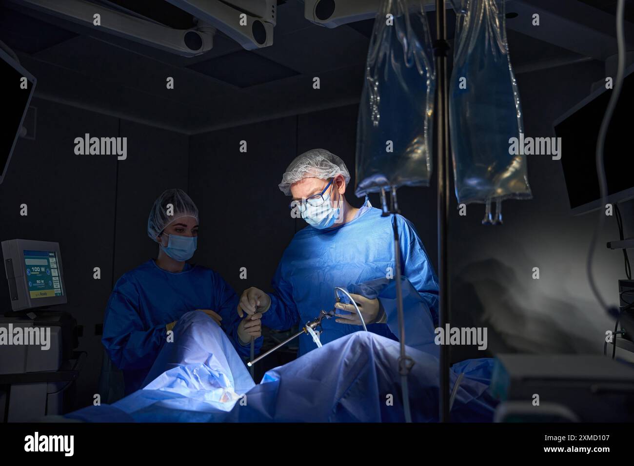 Surgery doctor operating patient in surgical room using surgical ...