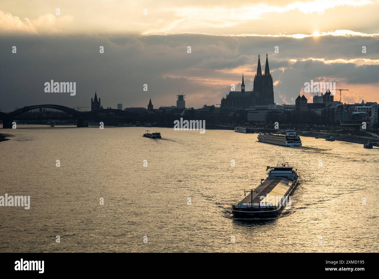 The Rhine near Cologne, sunset, Cologne Cathedral, cargo ship, North ...