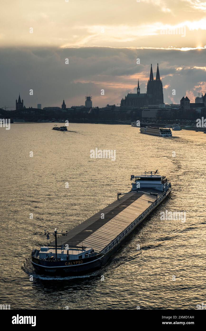 The Rhine near Cologne, sunset, Cologne Cathedral, cargo ship, North ...