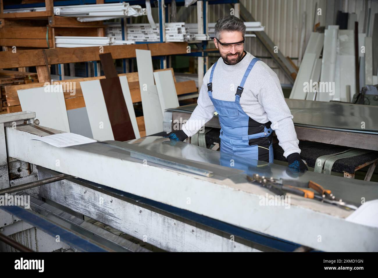 Professional works in a modern window production Stock Photo - Alamy