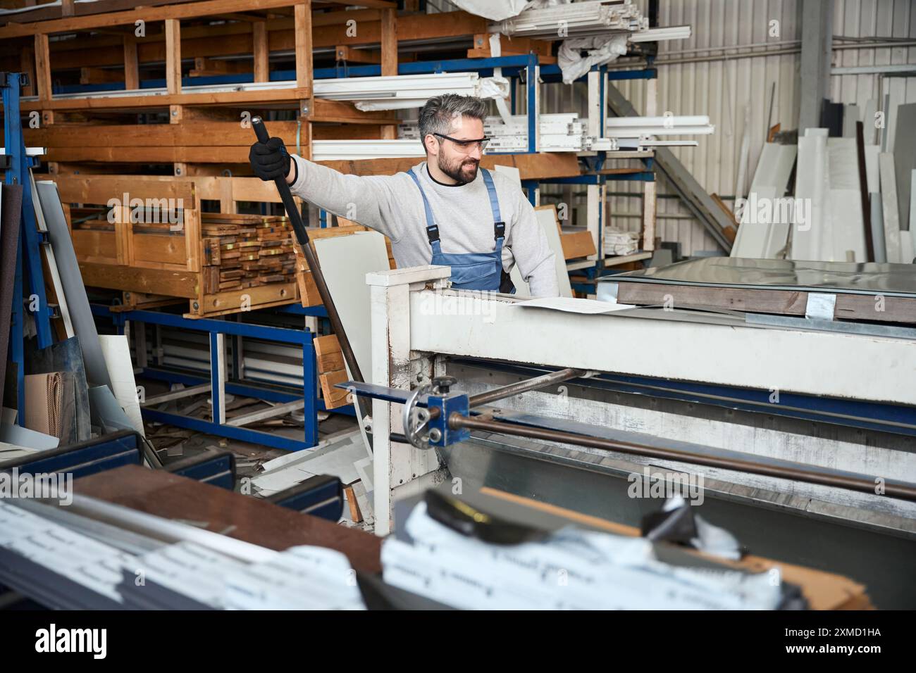Man forms a bend of an aluminum profile Stock Photo - Alamy