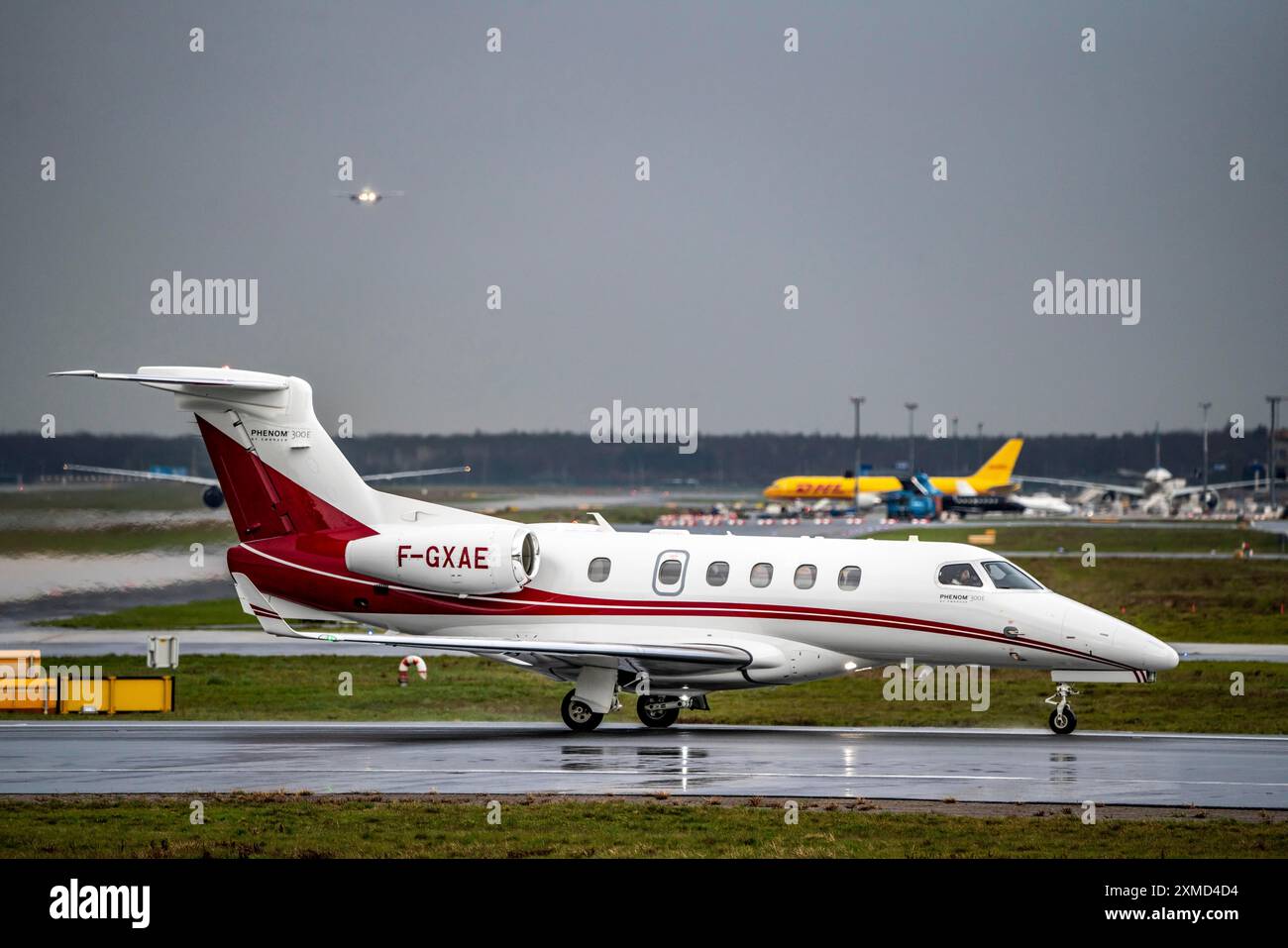 Private jet, Embraer Phenom 300 F-GXAE, on the western runway ...