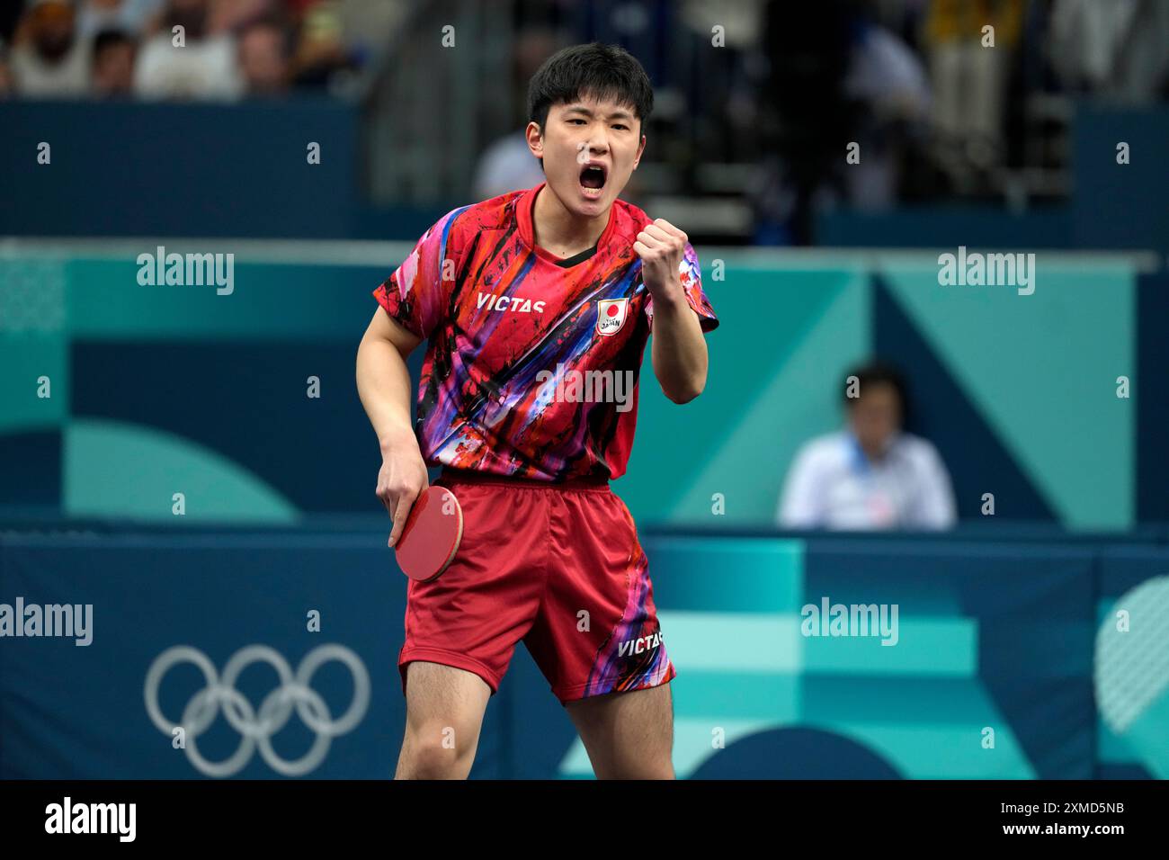Japan's Tomokazu Harimoto, reacts during a mixed doubles round of 16 ...