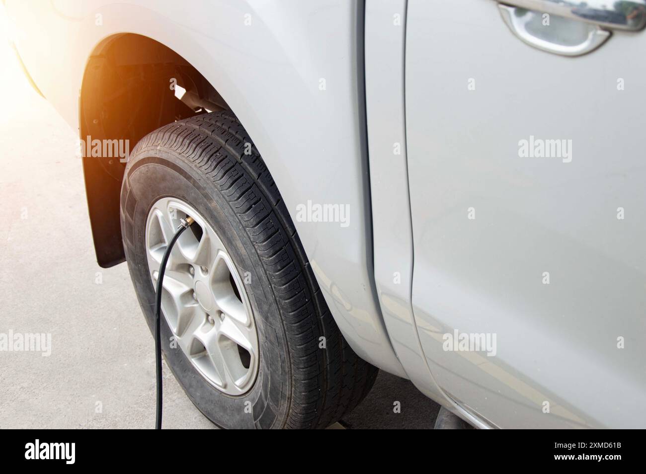 Ideas for inflating car tires and checking tire condition Stock Photo ...