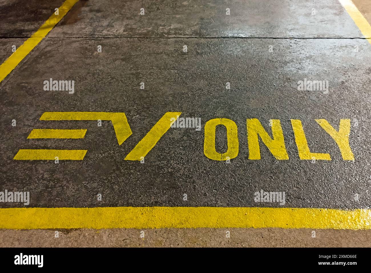 An area for writing EV Only messages and a space for parking EV cars to ...