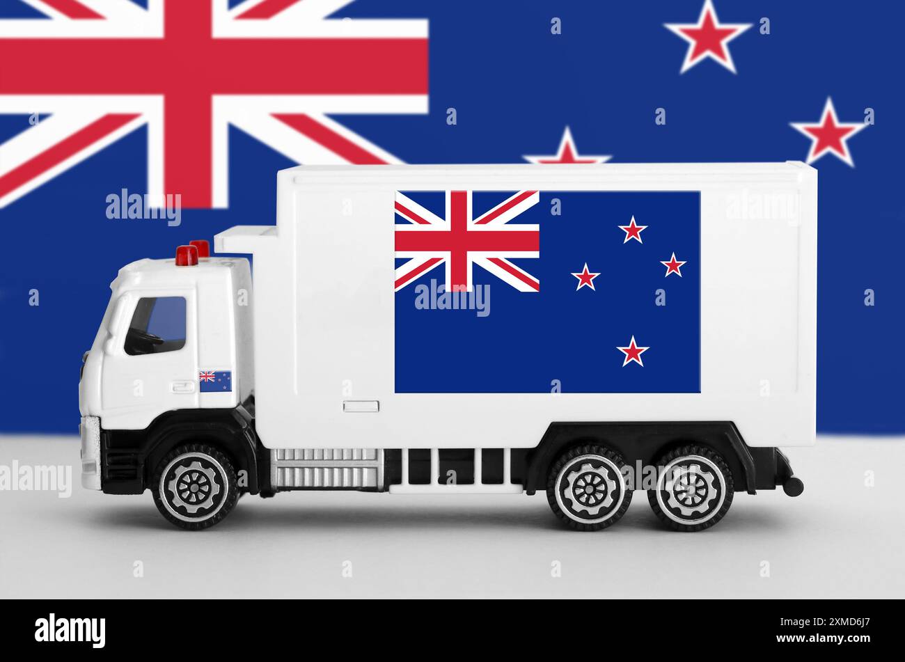 New Zealand flag depicted on side wall of white delivery van close up ...