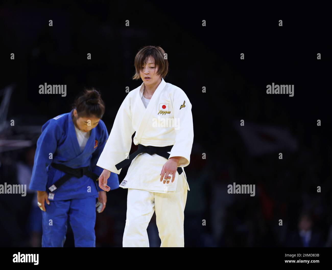 Natsumi Tsunoda of Japan (white) reactsafter winning the gold medal in ...