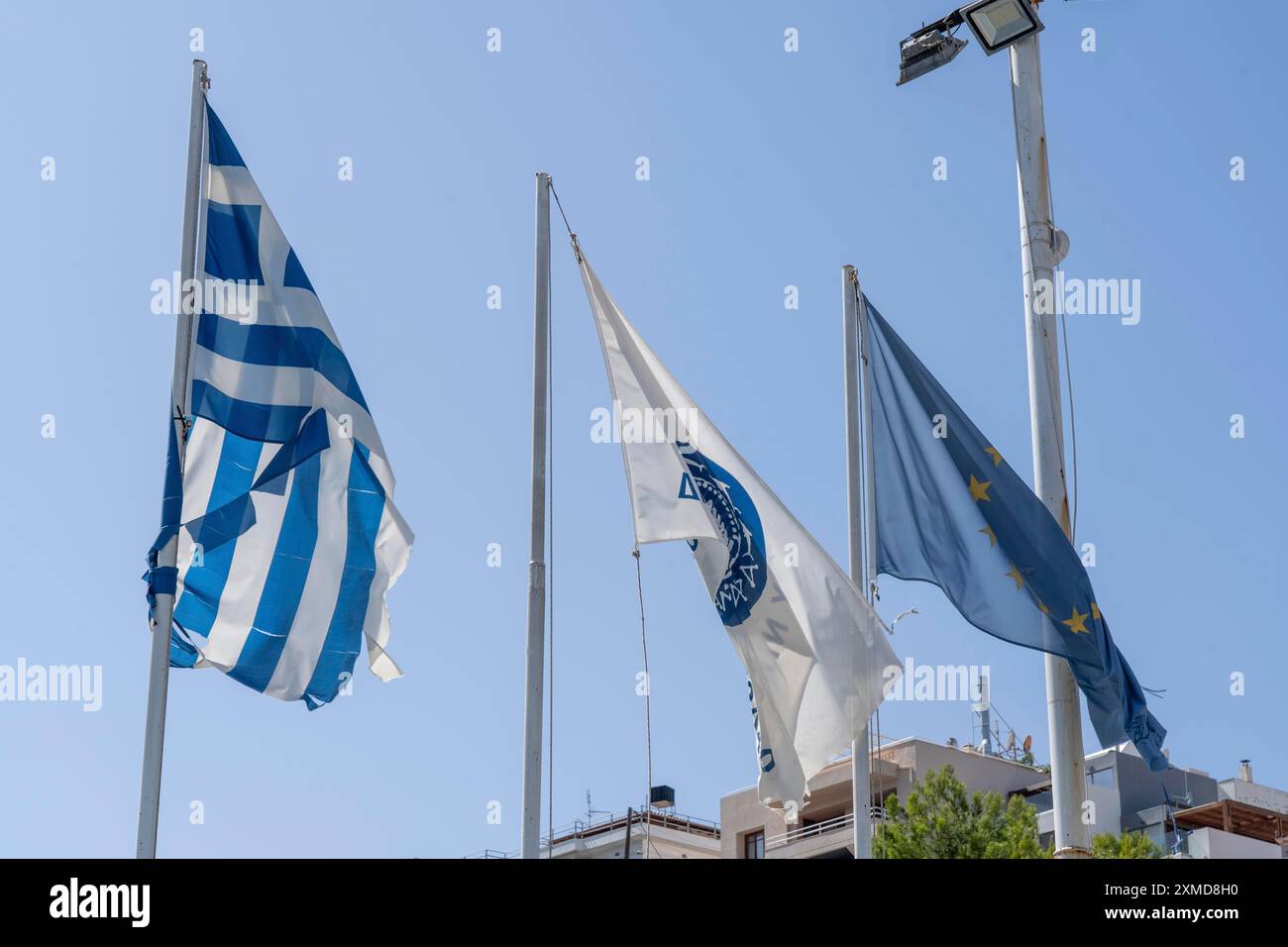 The place Agios Nikolaos, in the eastern part of Crete, Greek flags ...