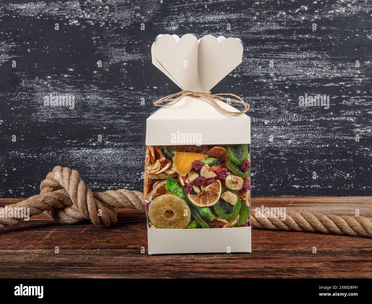 Gift box with dried fruit varieties. Nuts, dried fruit and candies in ...
