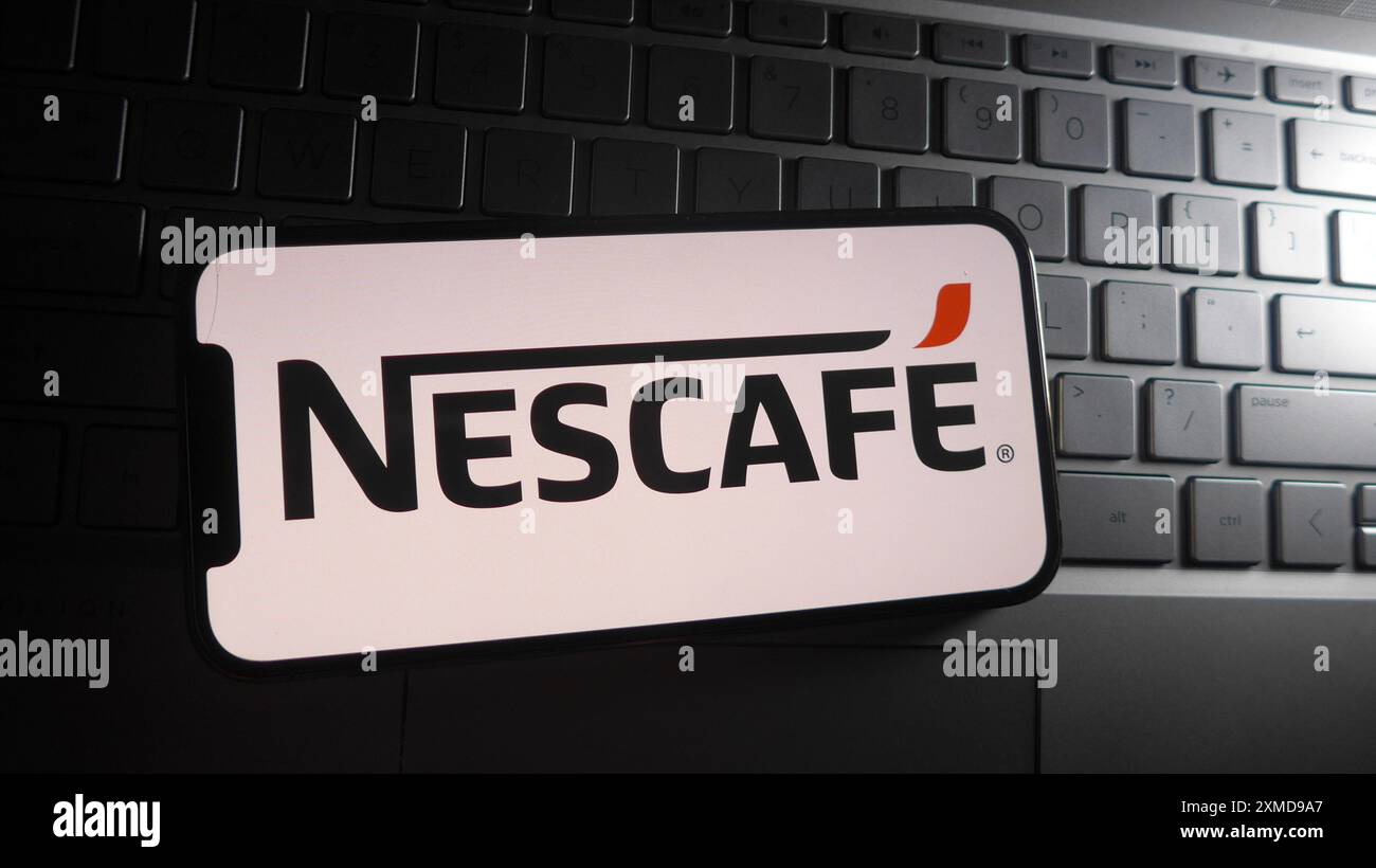In this photo illustration, NESCAFE logo is displayed on a smartphone ...