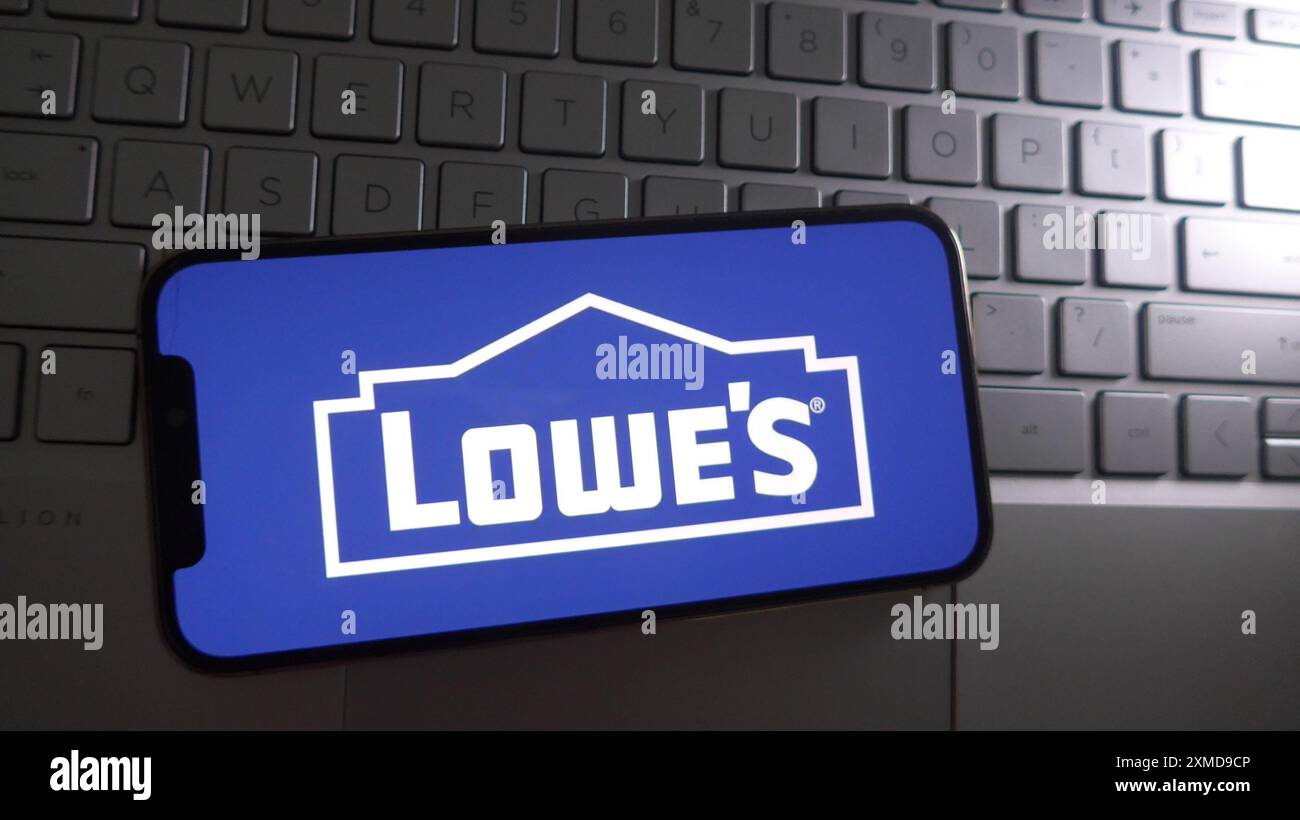 In this photo illustration, Lowe's logo is displayed on a smartphone ...