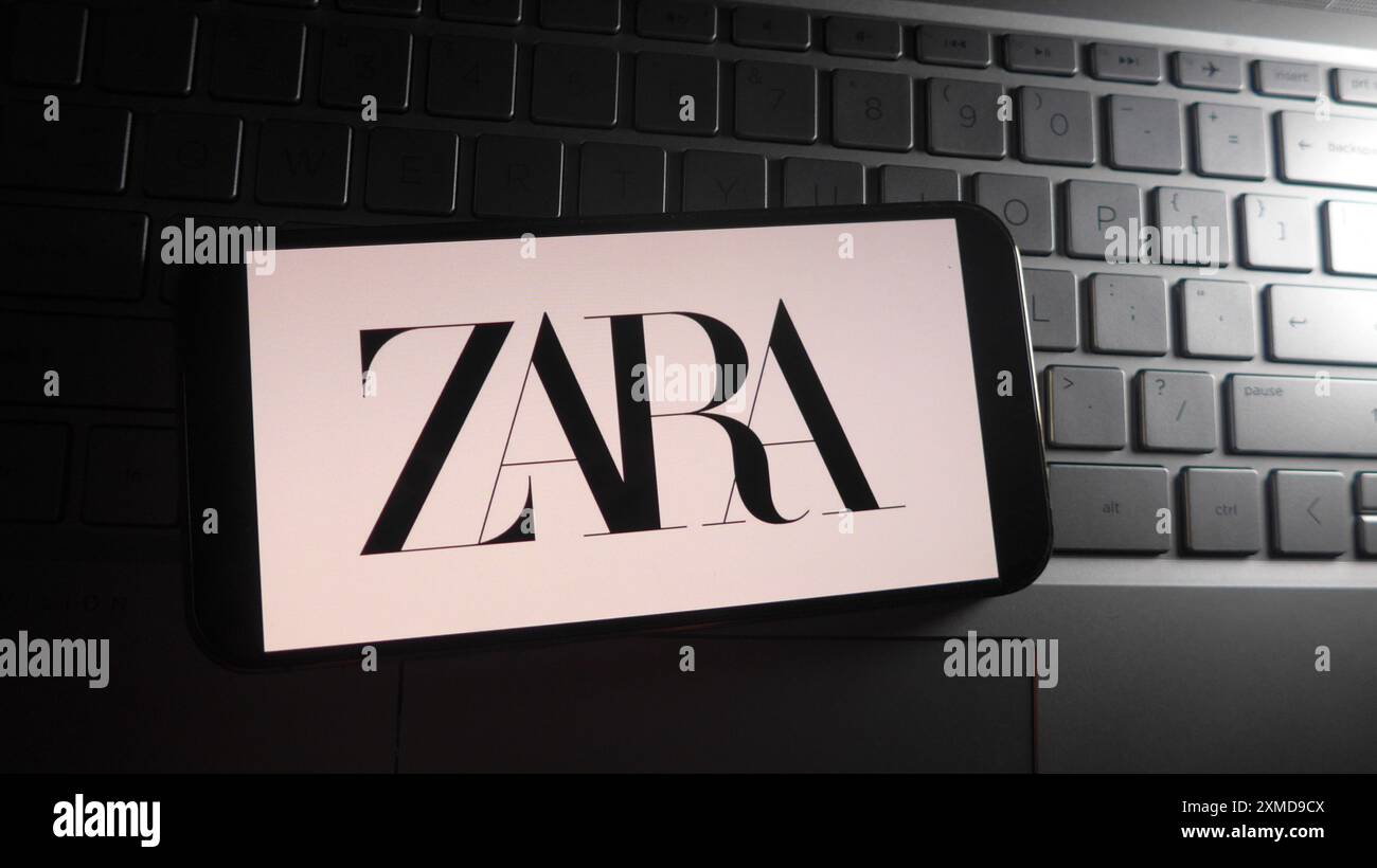 In this photo illustration, ZARA logo is displayed on a smartphone with ...
