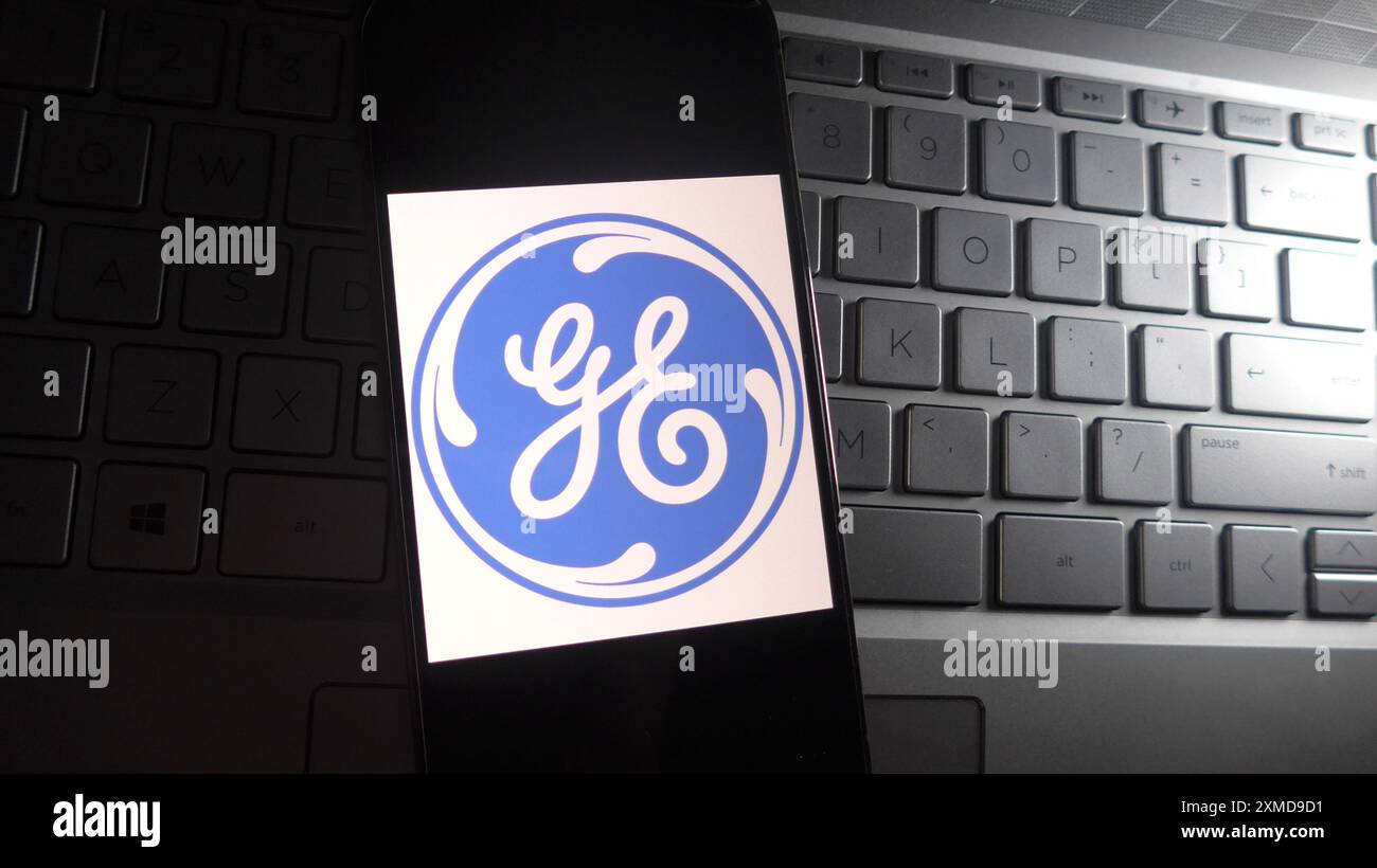 In this photo illustration, General Electric logo is displayed on a ...