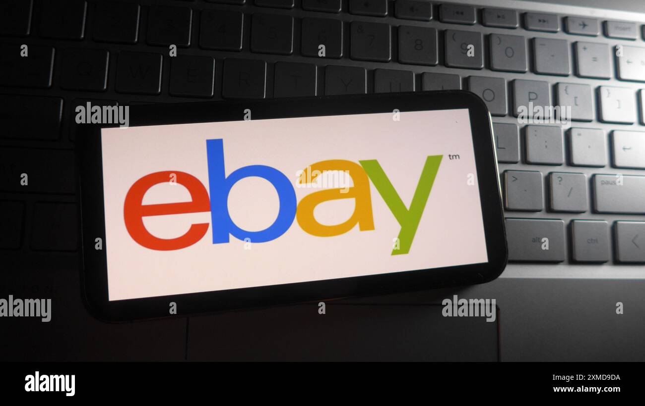 In this photo illustration, ebay logo is displayed on a smartphone with ...