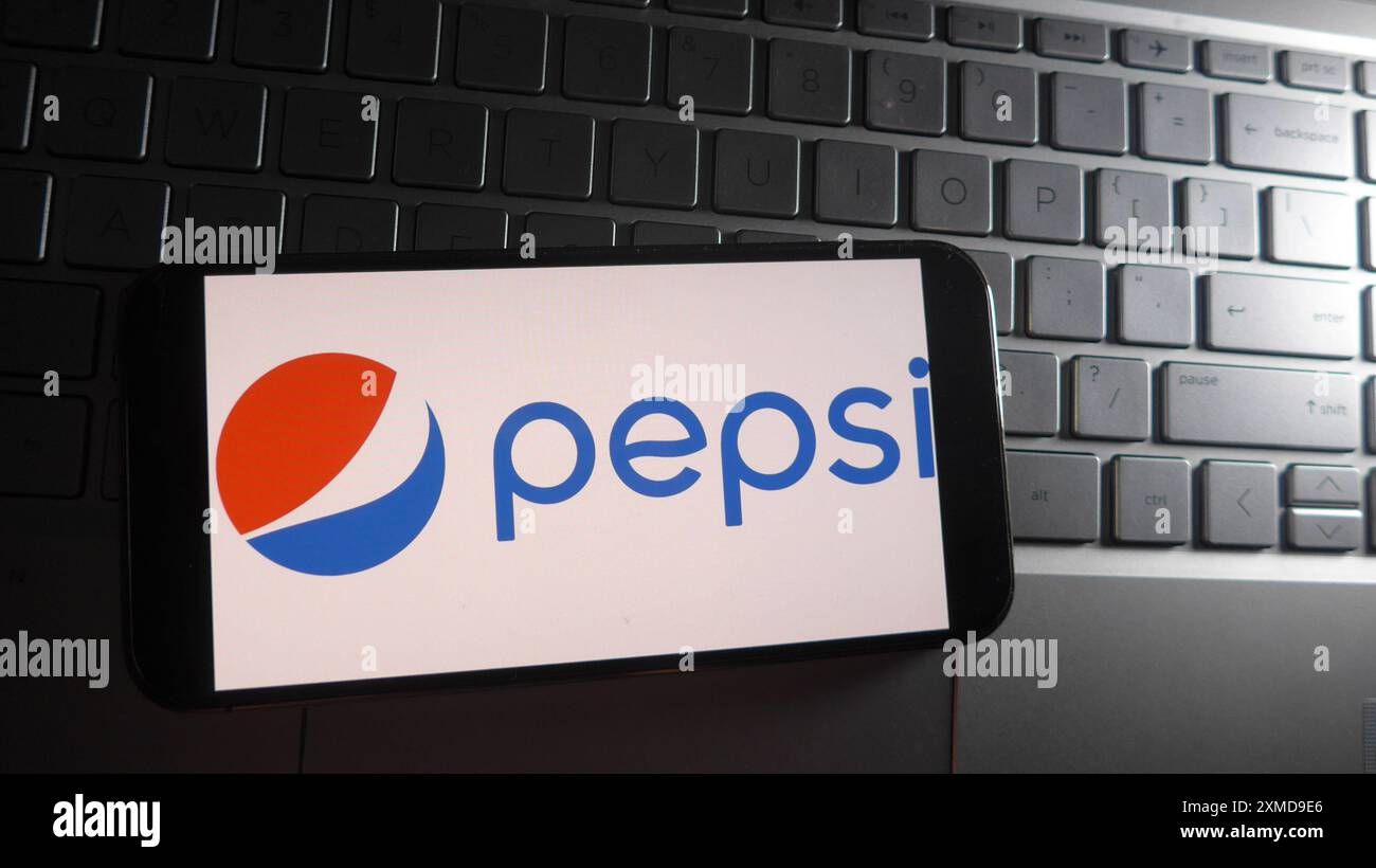 In this photo illustration, pepsi logo is displayed on a smartphone ...