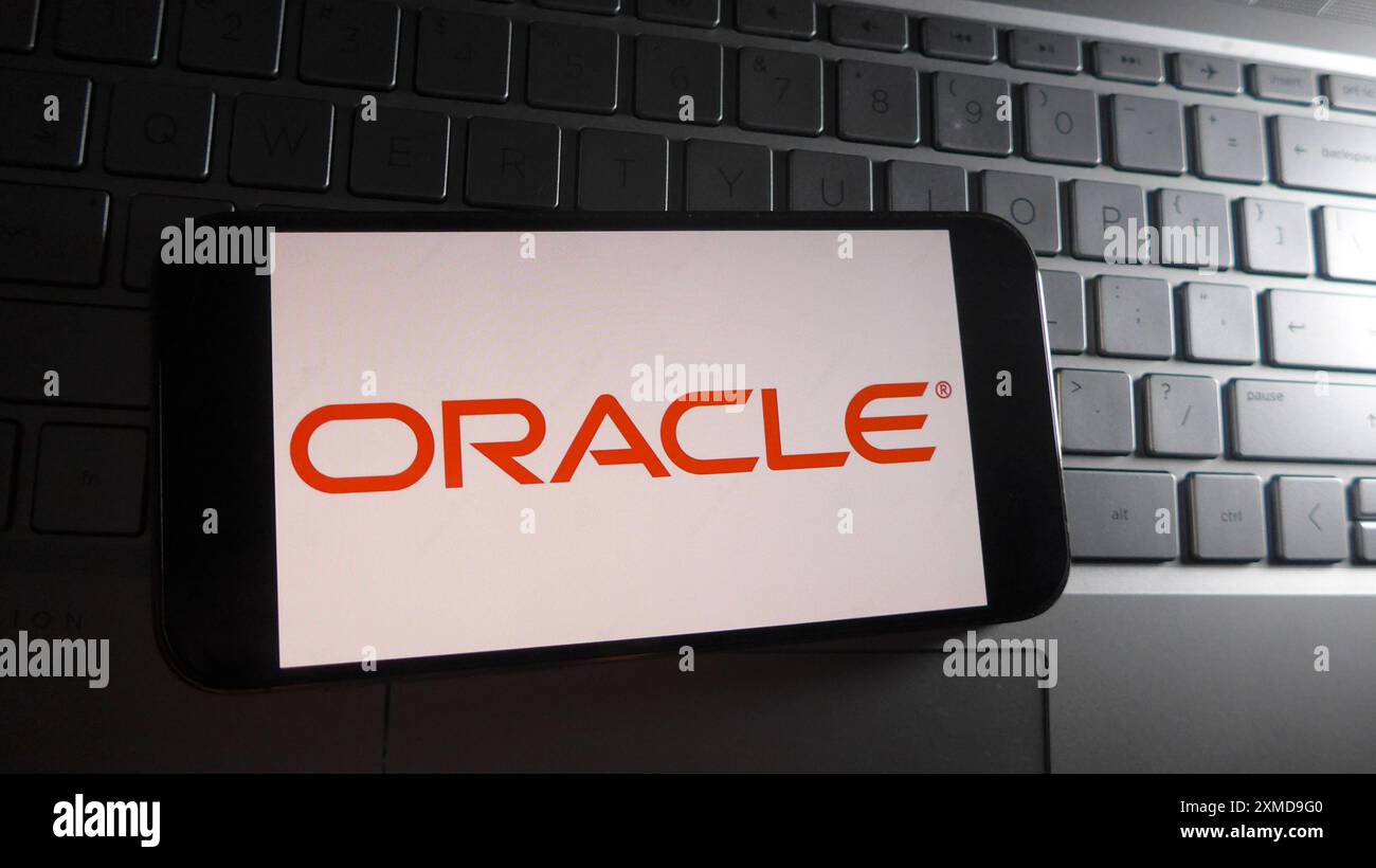 In this photo illustration, ORACLE logo is displayed on a smartphone ...