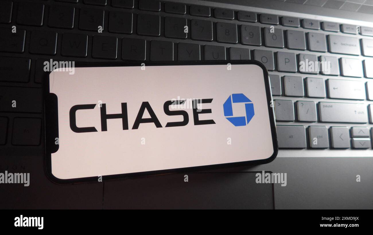 In this photo illustration, CHASE logo is displayed on a smartphone ...
