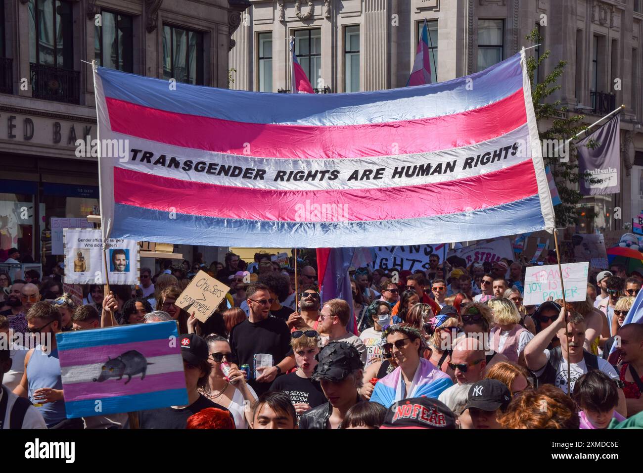 London, England, UK. 27th July, 2024. Participants hold a 'Transgender ...