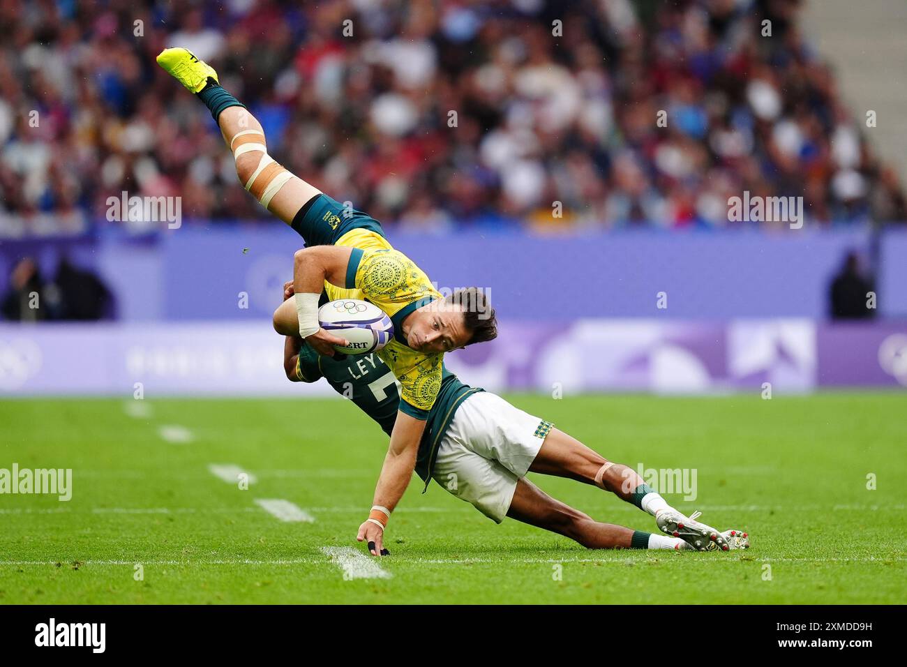 Australia's Hayden Sargeant is tackled by South Africa's Tristan Leyds ...