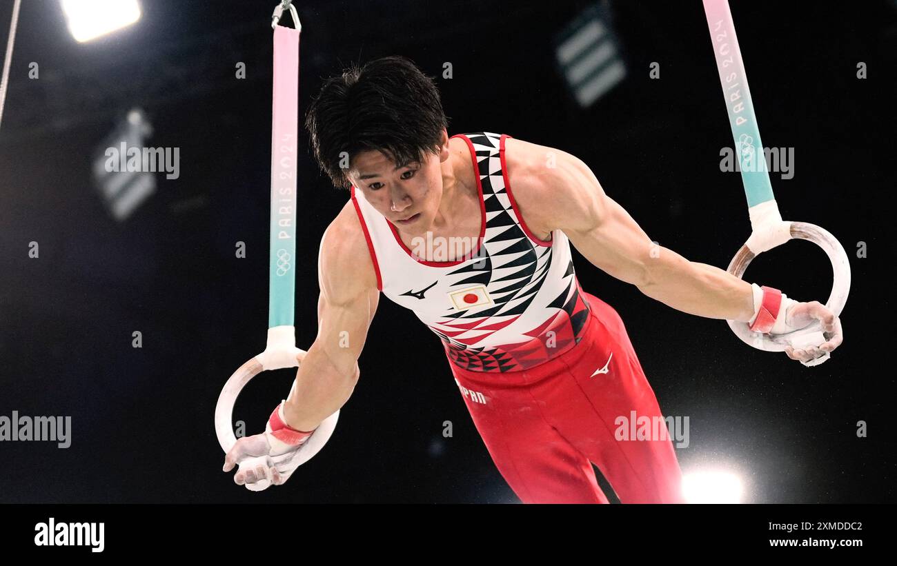Daiki Hashimoto, of Japan, competes on the rings during a men's ...