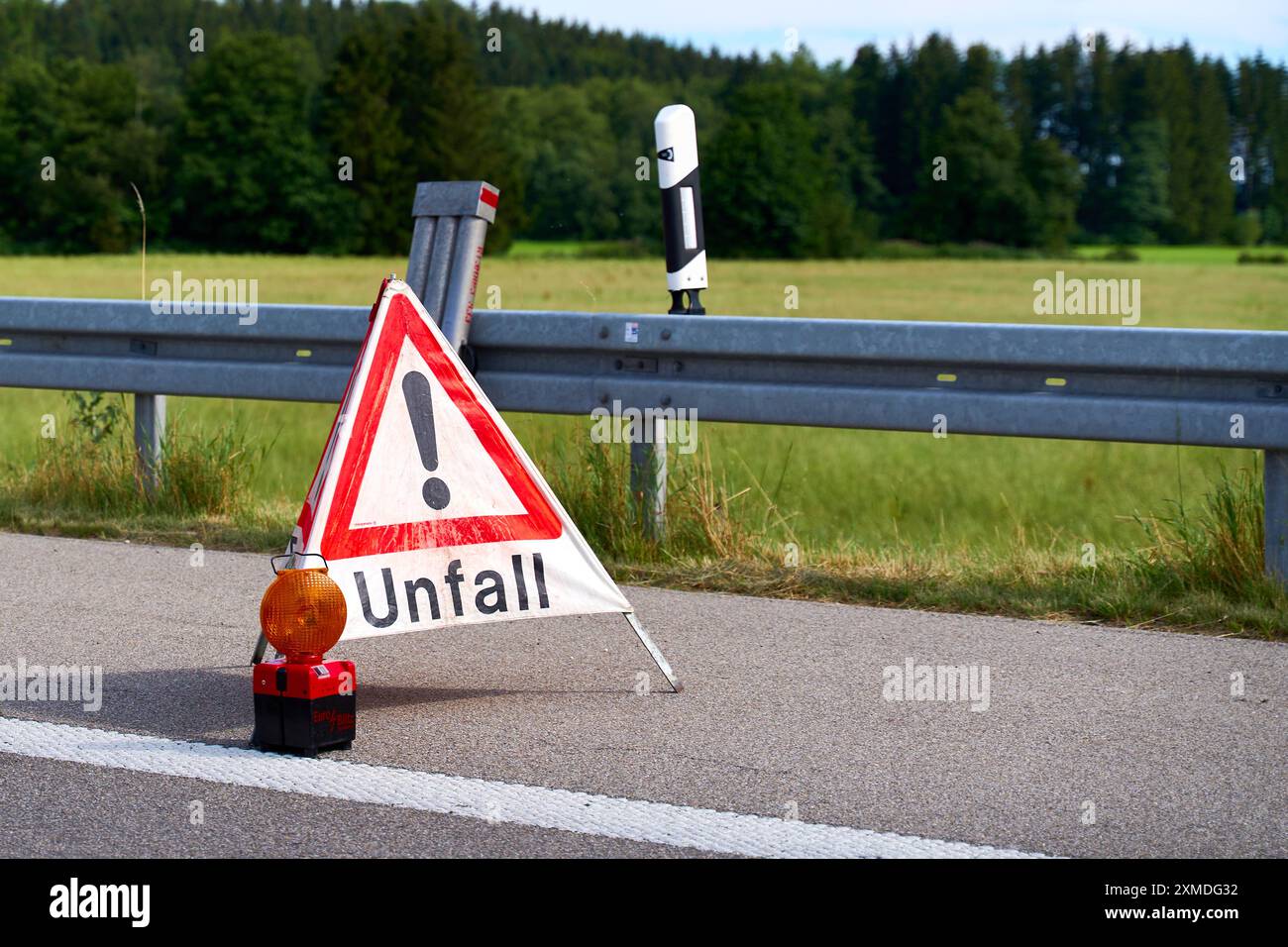Autobahn A96, Bavaria, Germany - 26 July 2024: A warning triangle with ...