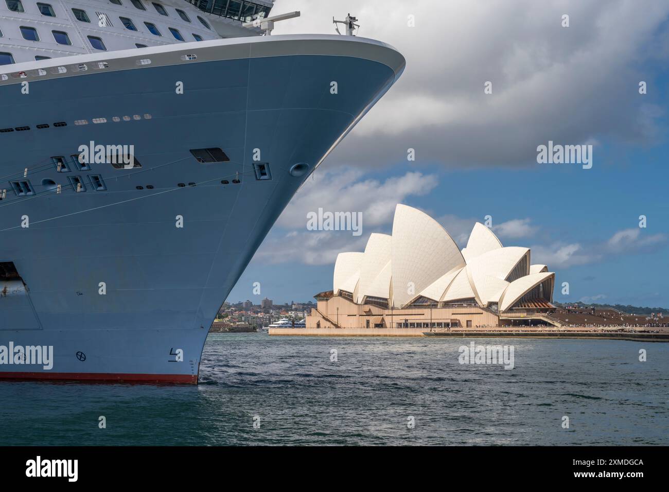 A cruise ship and the Opera House in the harbor at Sydney, Australia ...