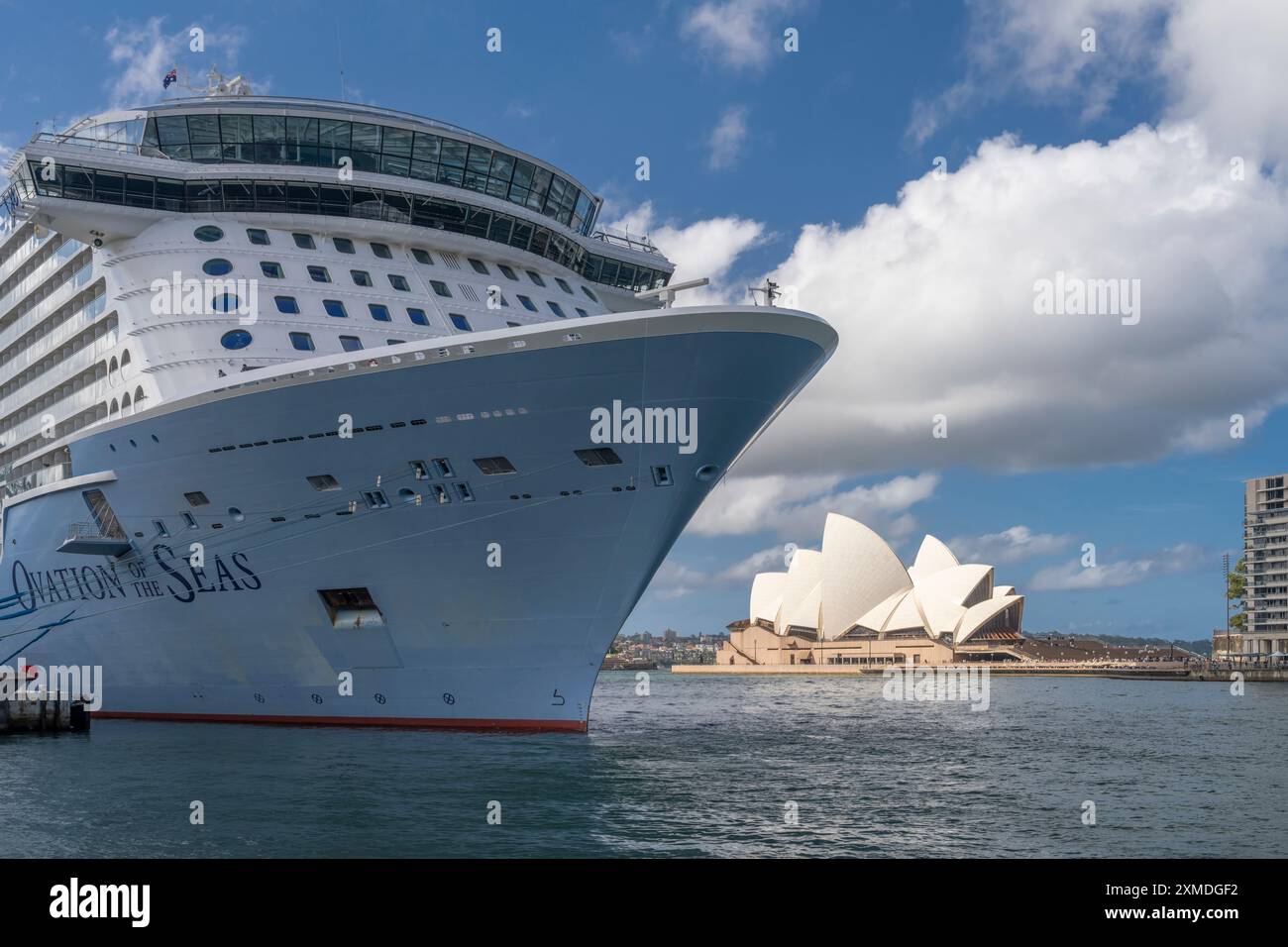 A cruise ship and the Opera House in the harbor at Sydney, Australia ...