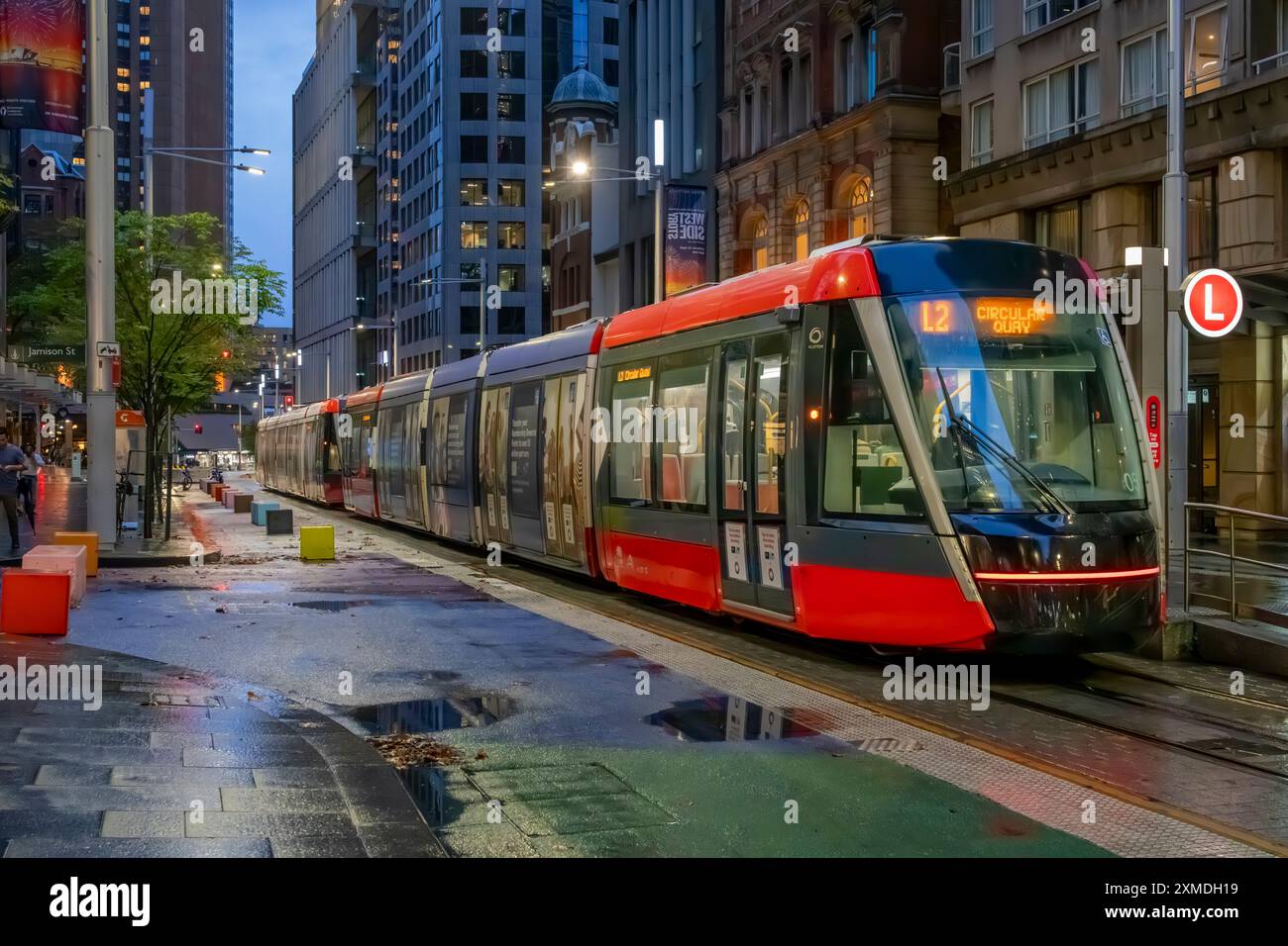 George Street trams in the rain with reflections in Sydney, Australia ...
