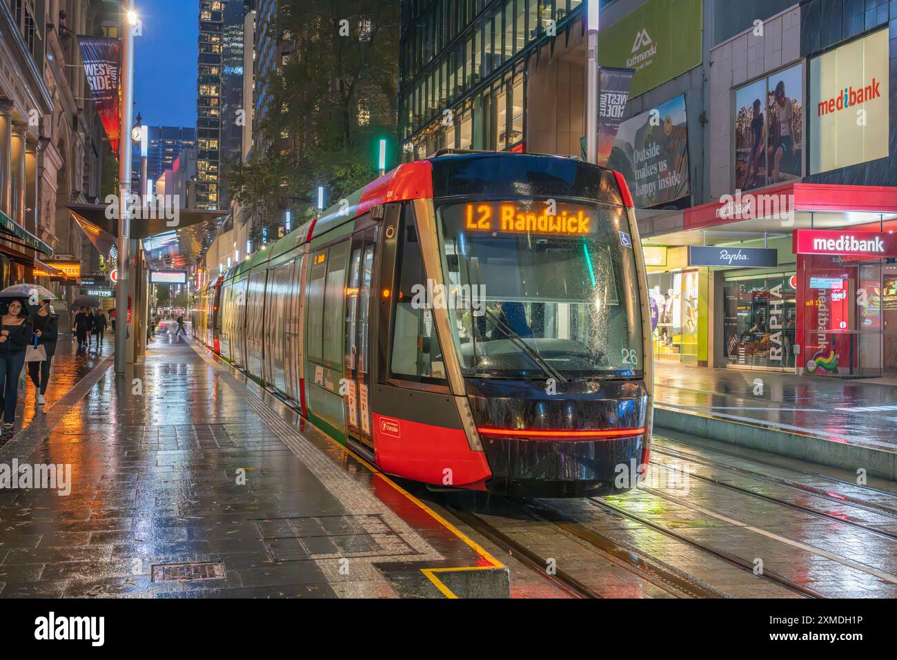 George Street trams in the rain with reflections in Sydney, Australia ...