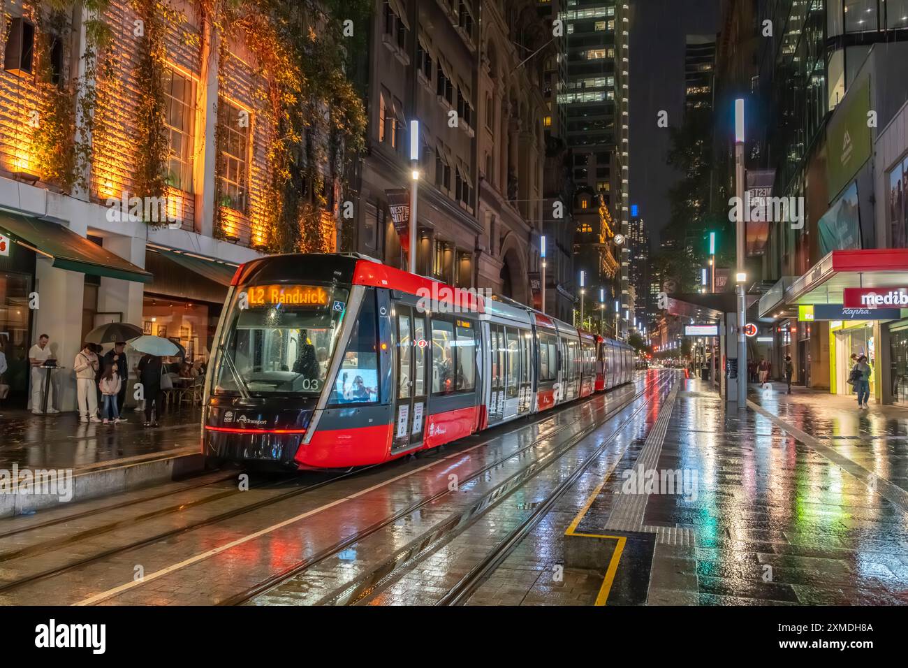 George Street trams in the rain with reflections in Sydney, Australia ...