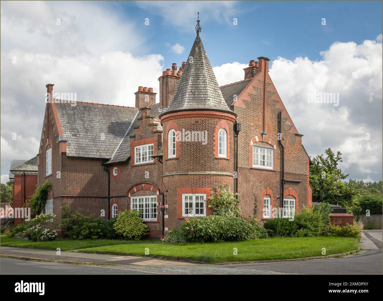 Port Sunlight, Wirral, UK - July 26th 2024 - House with a tower and a ...