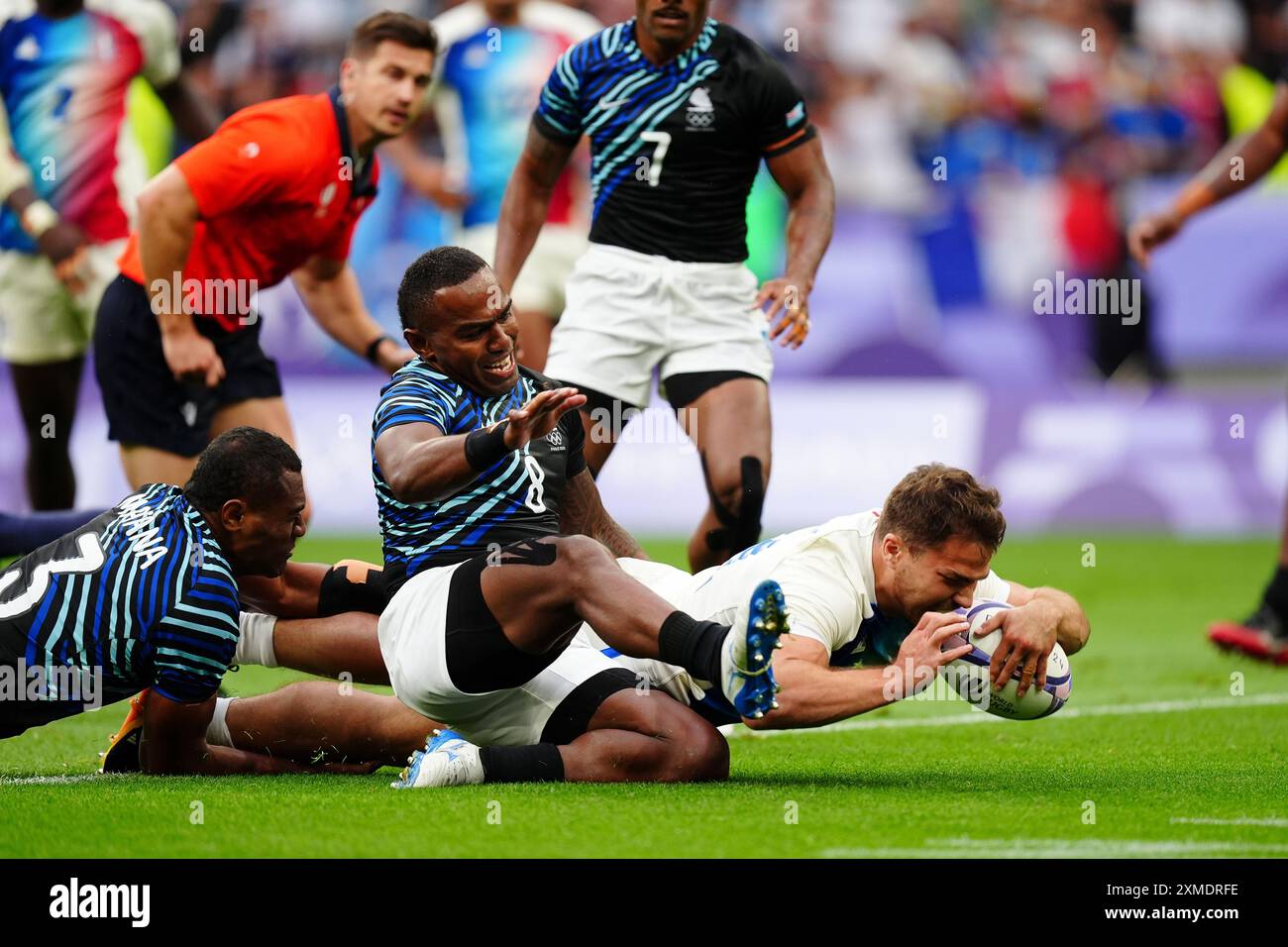 France's Antoine Dupont (right) scores a try during the rugby sevens ...
